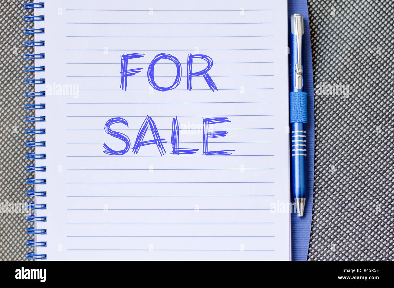 For sale write on notebook Stock Photo - Alamy