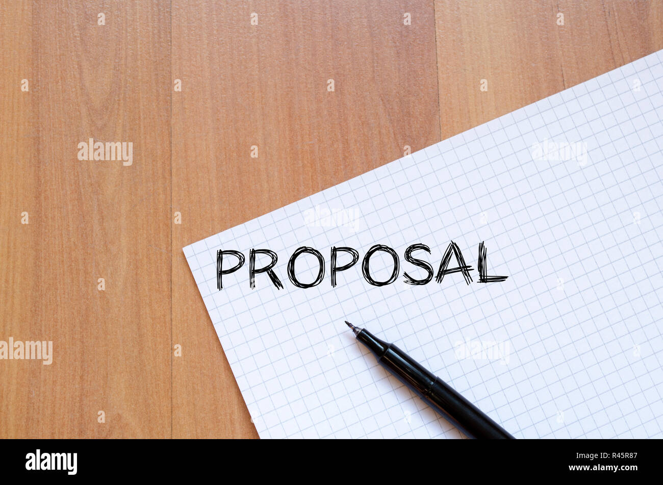 Proposal write on notebook Stock Photo - Alamy