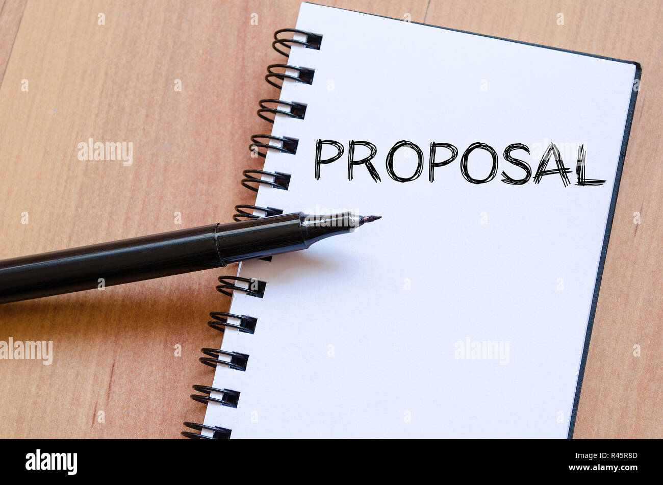 Proposal write on notebook Stock Photo - Alamy