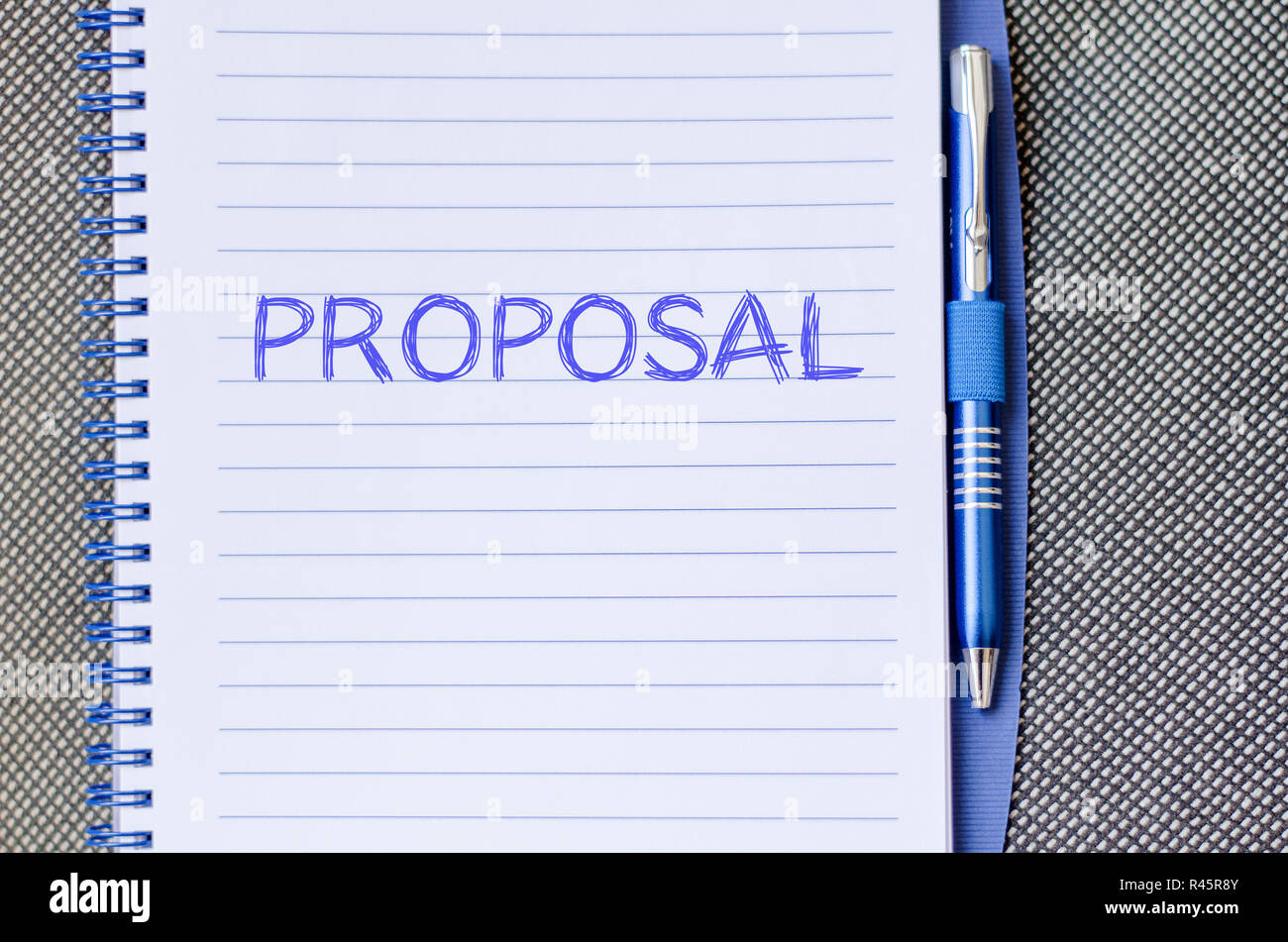 Proposal write on notebook Stock Photo - Alamy