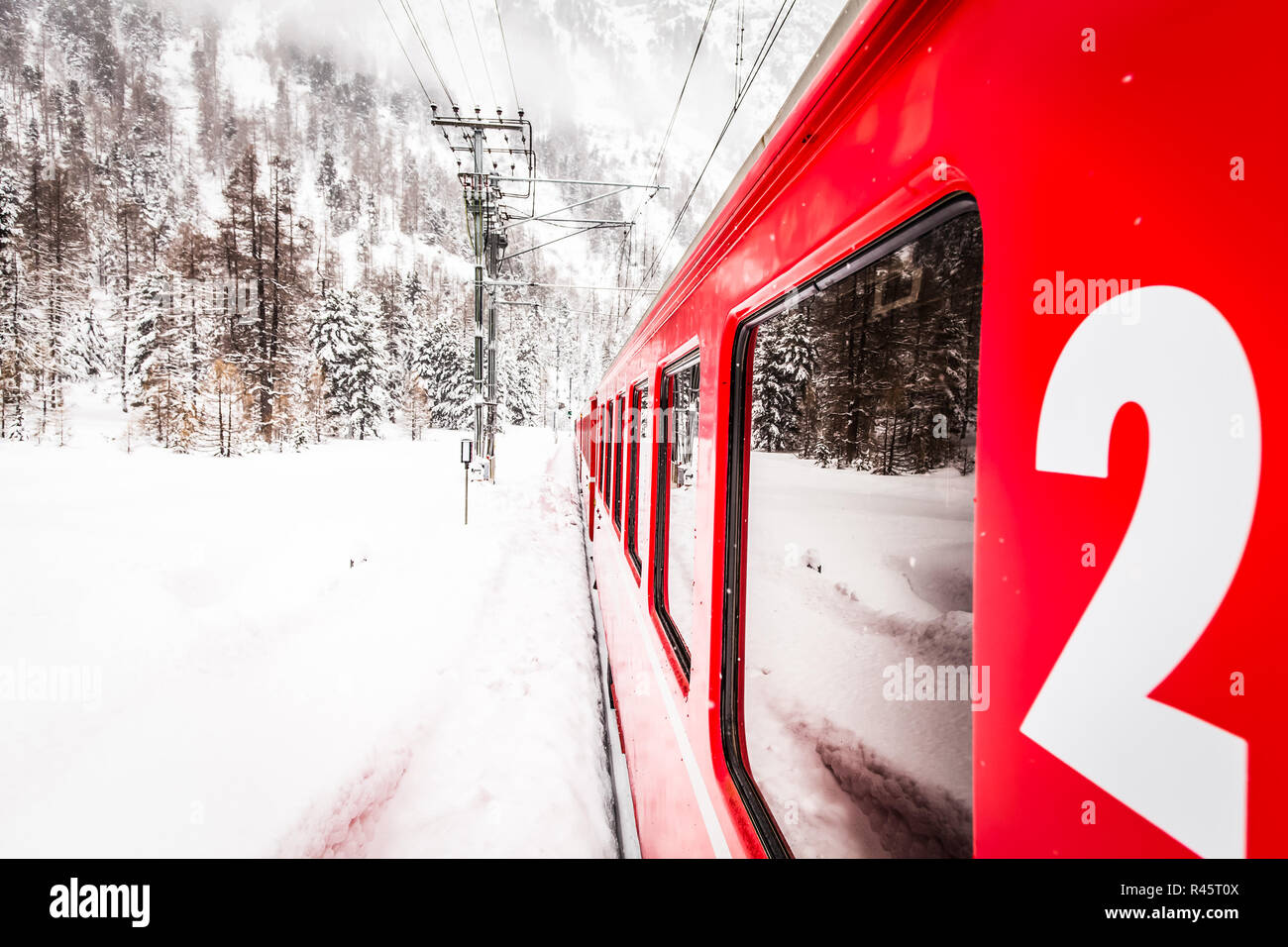 Train in the snow Stock Photo - Alamy
