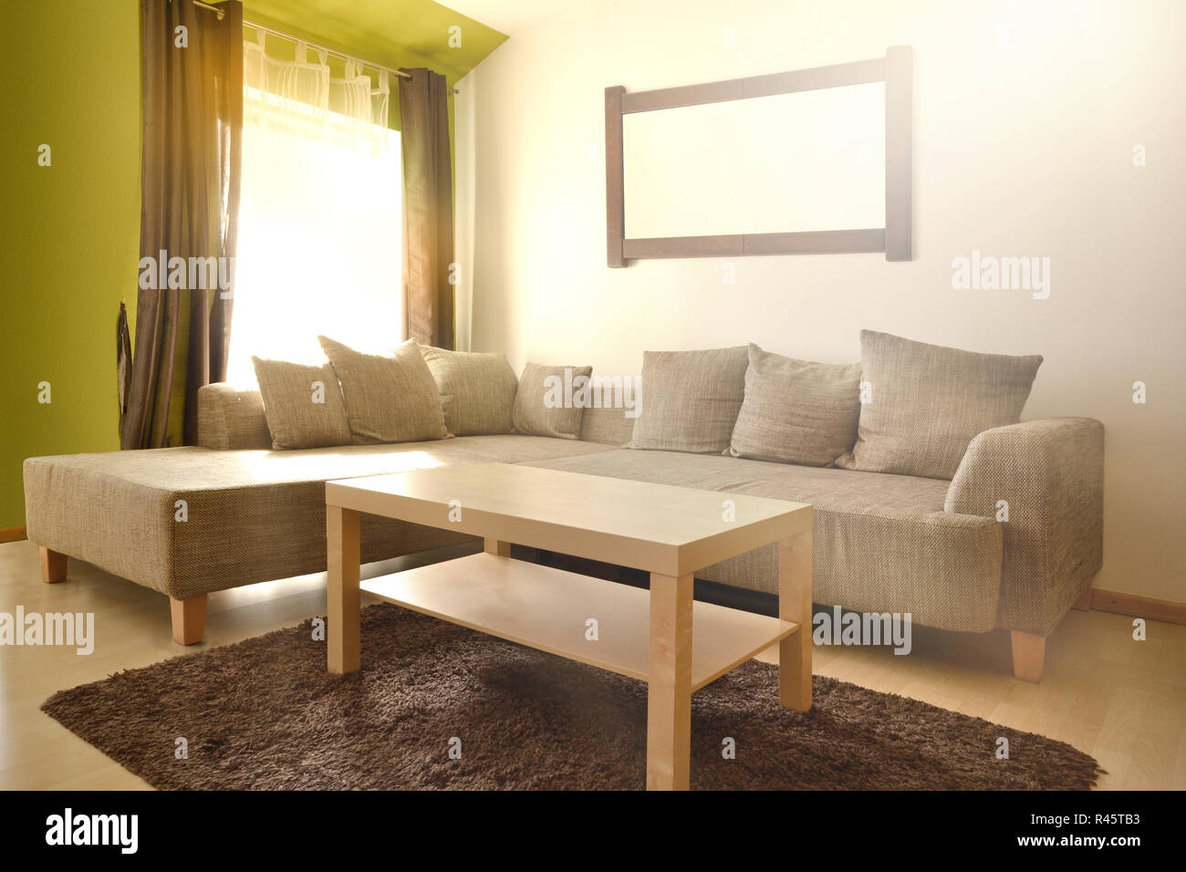 pretty living room example with picture on wall placeholder Stock Photo ...
