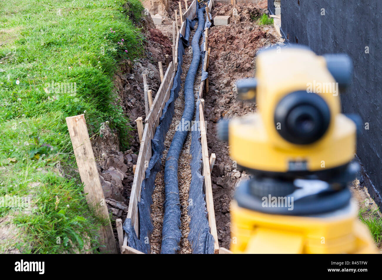 Surveyor equipment optical level at construction site Stock Photo - Alamy