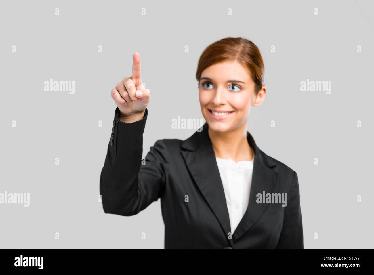 Beautiful businesswoman pointing Stock Photo - Alamy