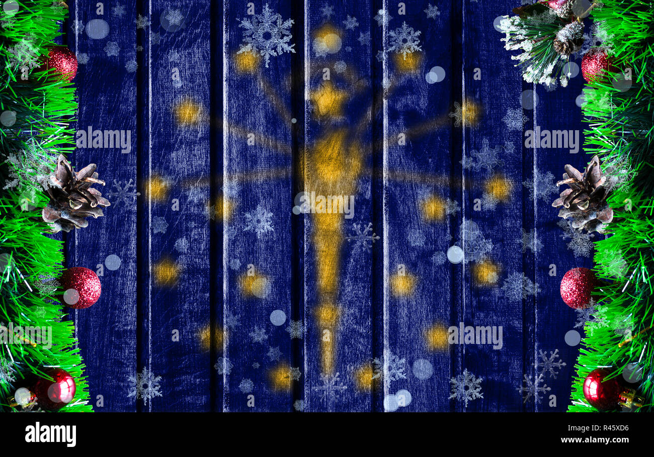 Wooden Christmas background with blurred flag State of Indiana. There ...