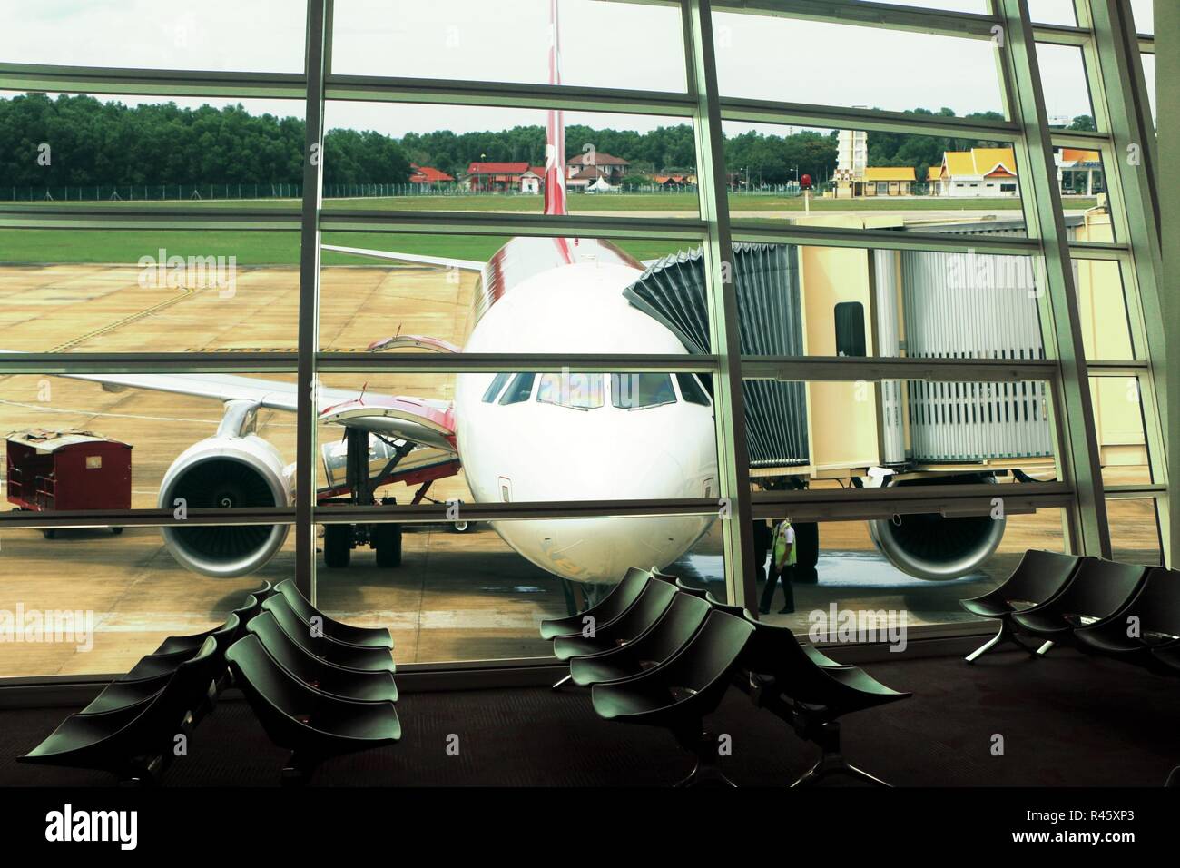 Airport window view at departure hall Stock Photo - Alamy