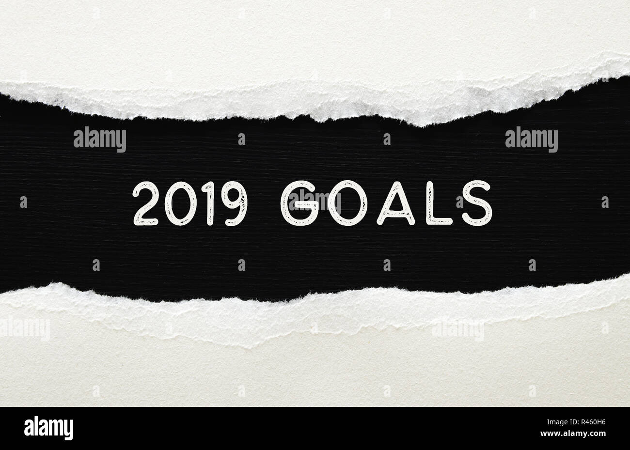 2019 goals list written over torn paper on black background Stock Photo ...