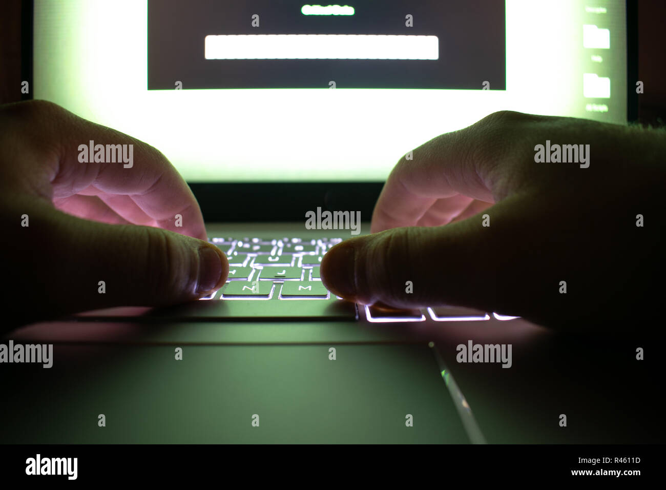 Hacker using laptop lots digits hi-res stock photography and images - Alamy