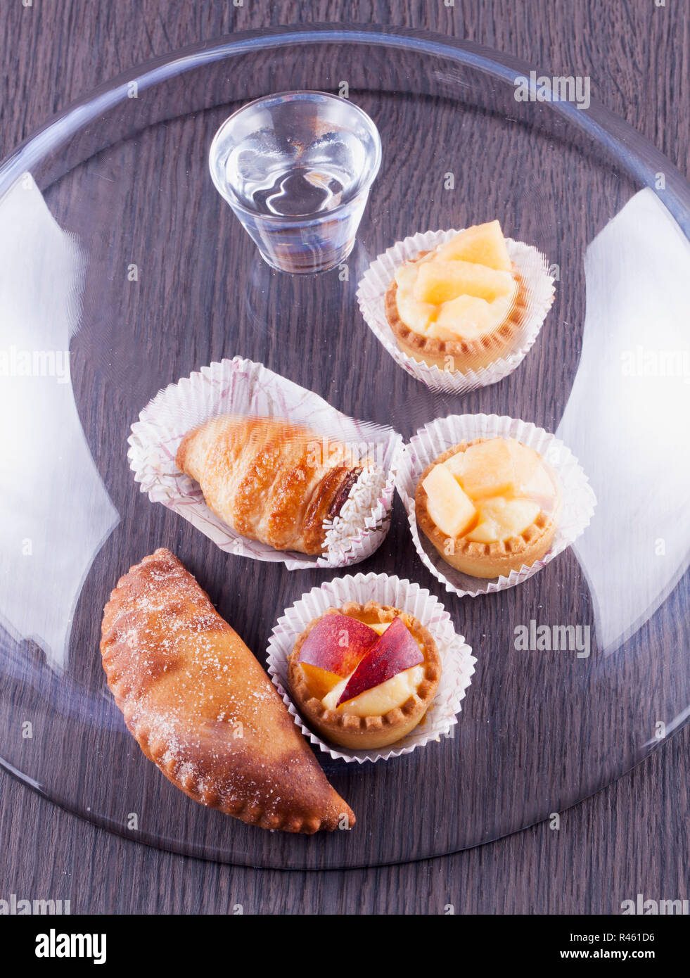 Pastries under glass Stock Photo - Alamy