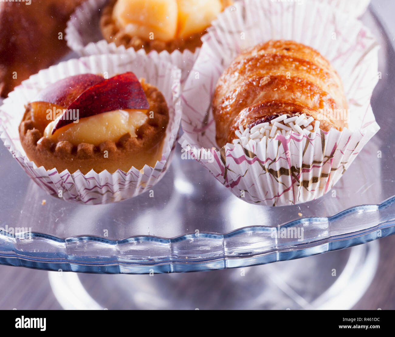 Pastries under glass Stock Photo - Alamy