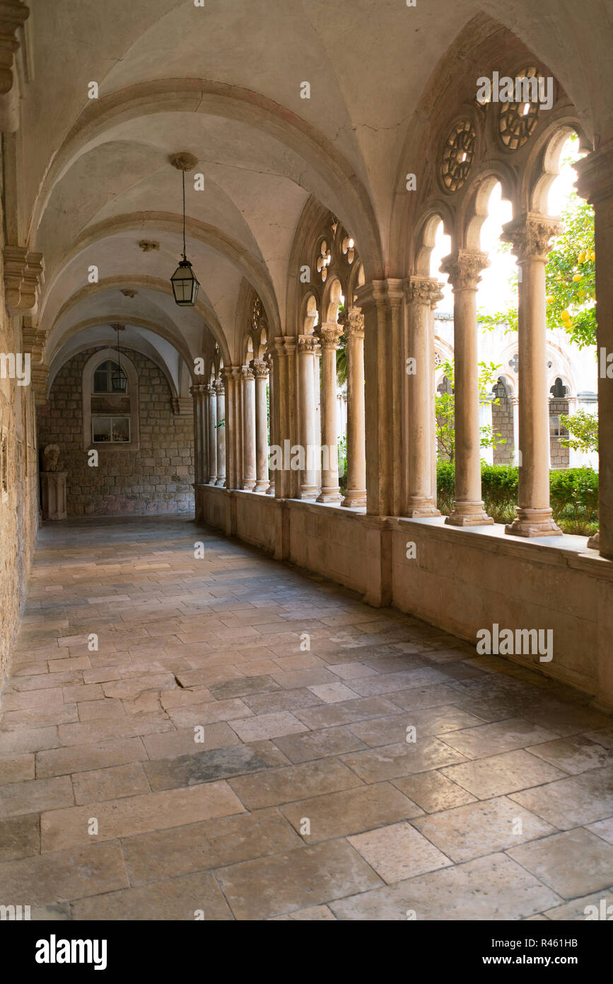Cloister with beautiful arches and columns in old Dominican monastery ...