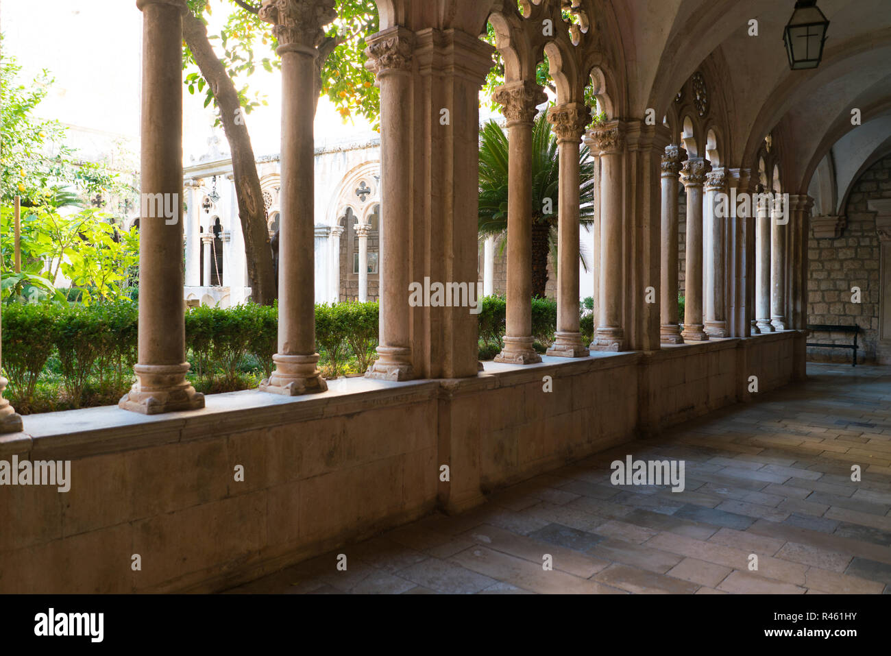 Cloister with beautiful arches and columns in old Dominican monastery ...