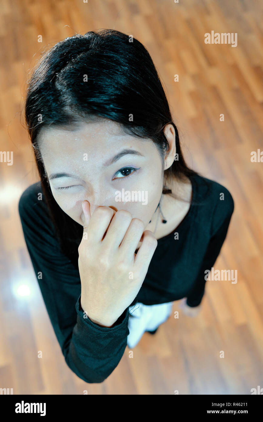 Beautiful woman posing - look up, facial expression, wink, smelling ...