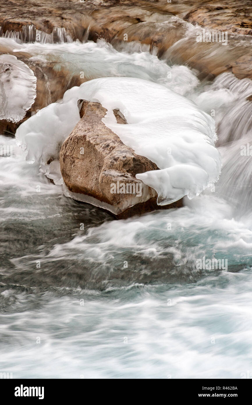 Icy Rock in River Stock Photo - Alamy