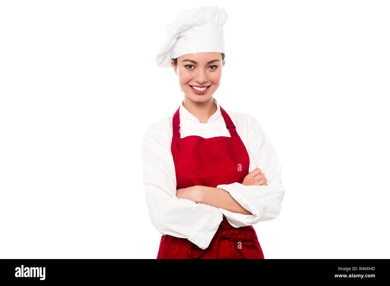 Beautiful smiling chef posing over white Stock Photo - Alamy