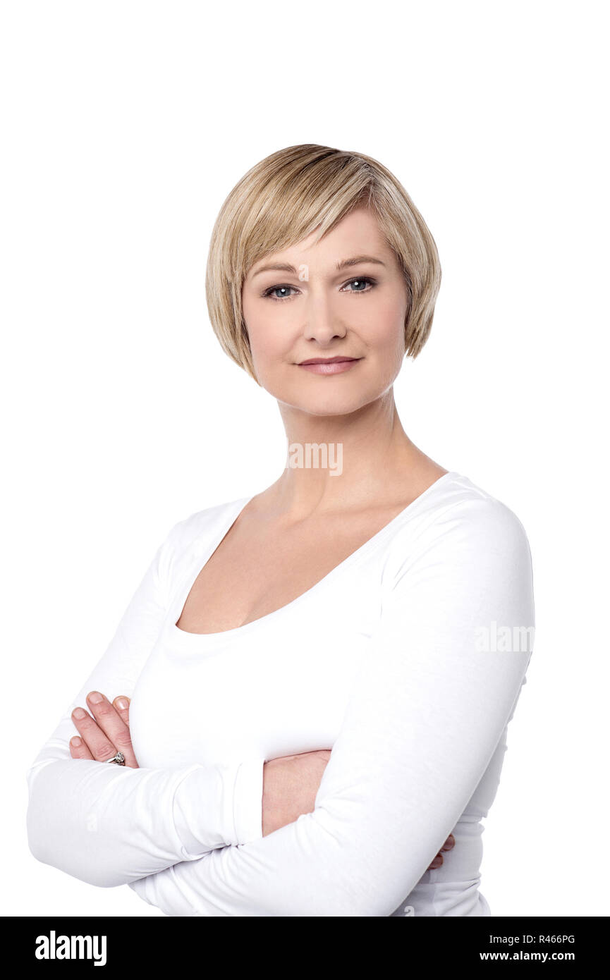 Smiling middle aged lady, arms crossed Stock Photo - Alamy