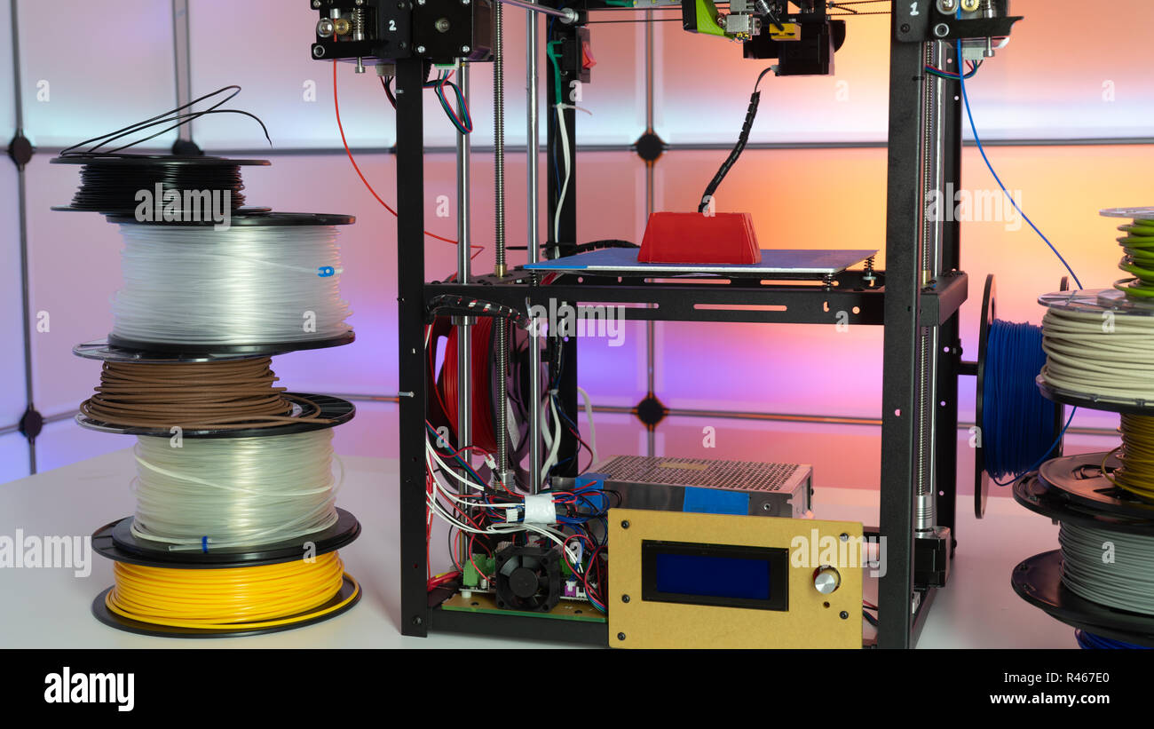 3d printer and plastic filament on color background Stock Photo - Alamy