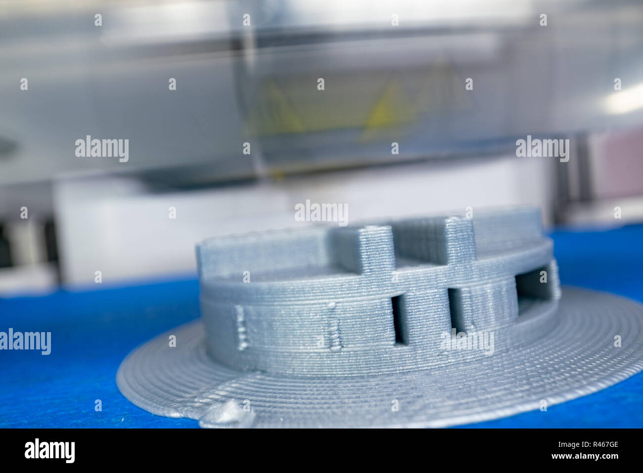 Close up of 3d printing. 3d printer printing objects form plastic ...