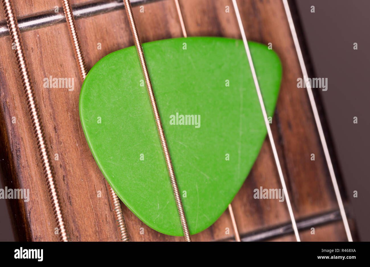 Plectrum Stuck in Steel Strings Stock Photo - Alamy
