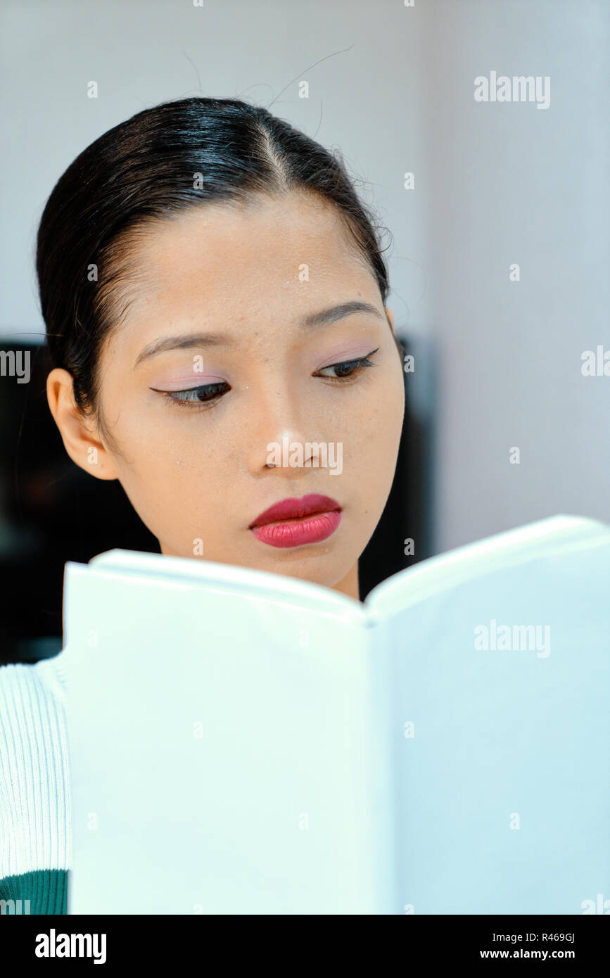 Beautiful women posing - reading a book, serious woman, close-up Stock ...
