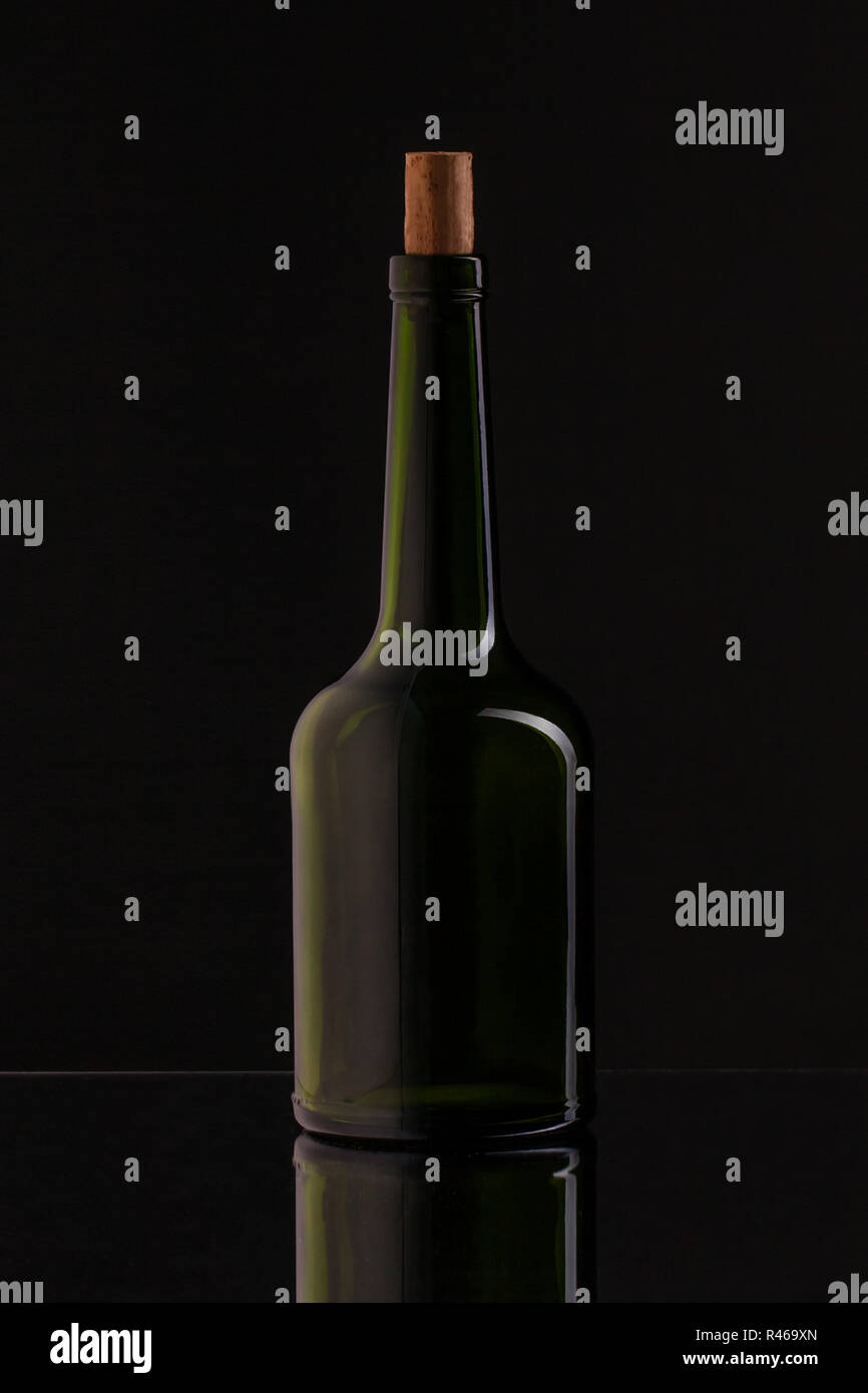 Wine bottle on a black background. Soft beautiful highlights on the ...