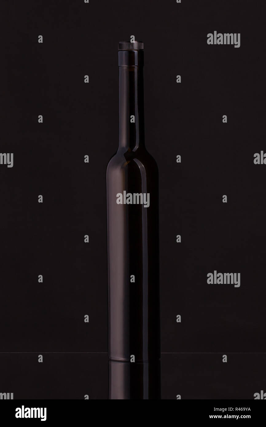Wine bottle on a black background. Soft beautiful highlights on the ...