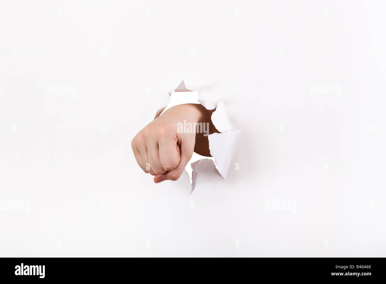 direct view of the fist breaks a paper Stock Photo - Alamy