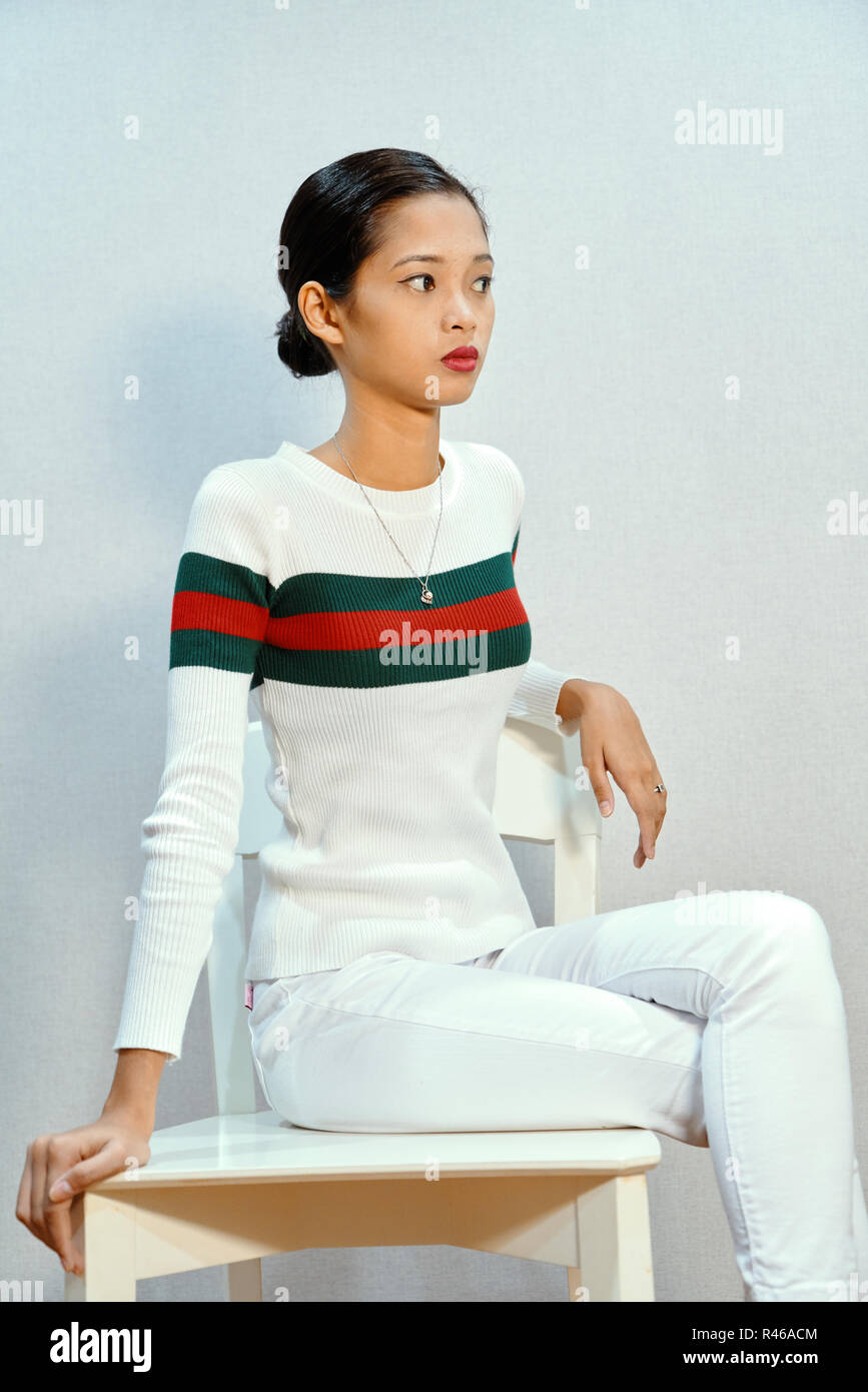 Sad girl sitting cross legged hi-res stock photography and images - Alamy