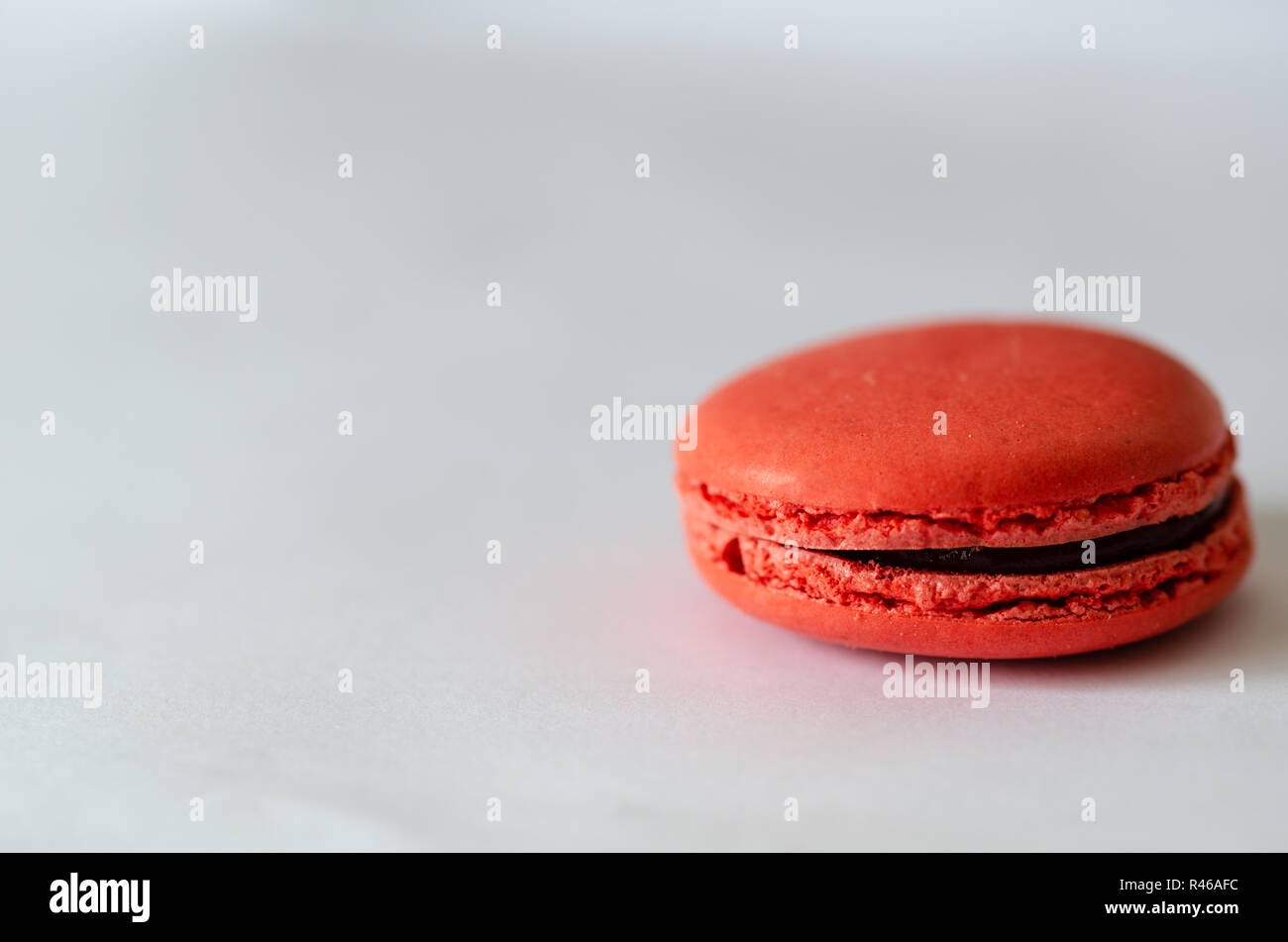 Red macaroons is on the white background Stock Photo - Alamy