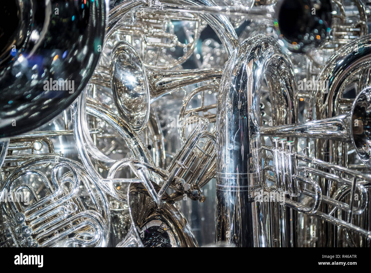 Shiny musical instruments from the horn section in a close up abstract ...
