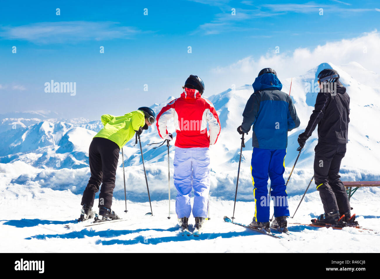 Group of friends skiing Stock Photo - Alamy