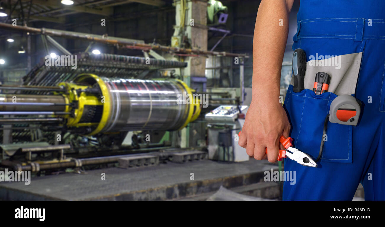 Worker with instruments Stock Photo - Alamy