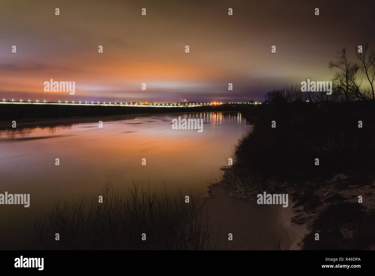 Beautiful winter night landscape with river and street lihgts Stock ...