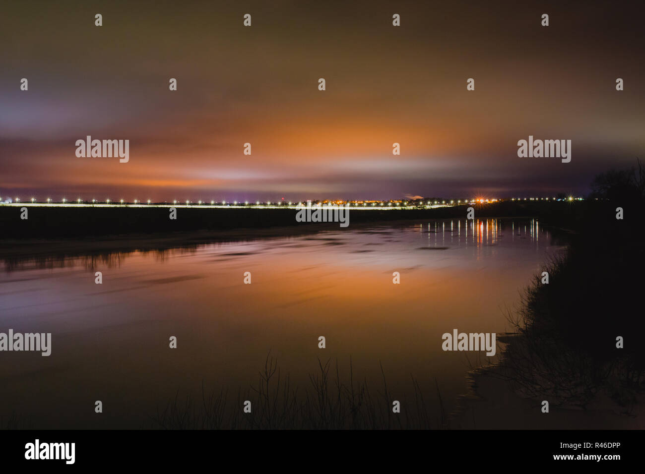 Beautiful winter night landscape with river and street lihgts Stock ...