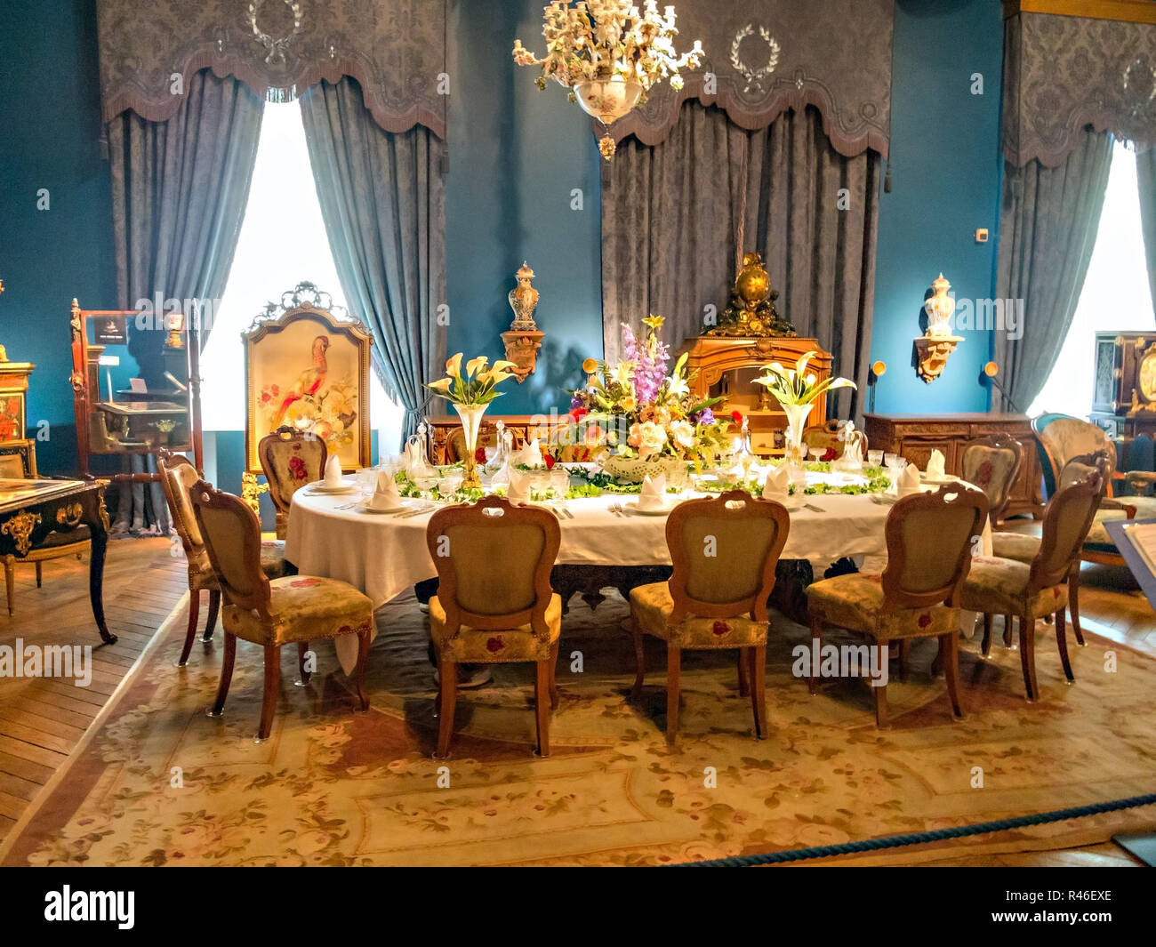 Regency period dinning room table set for dinner in the Bowes museum at ...
