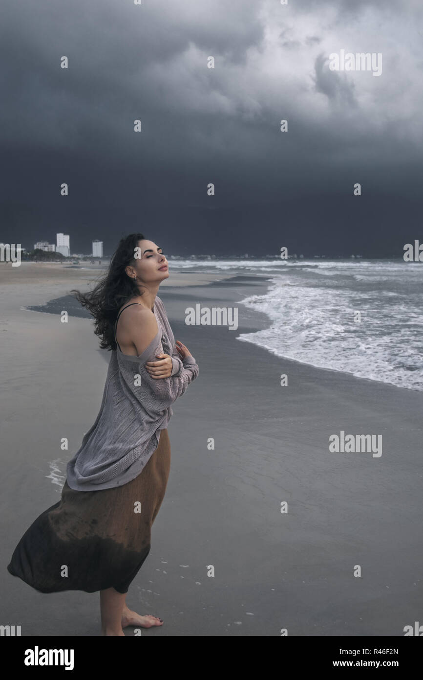 Woman windy day dress High Resolution Stock Photography and Images - Alamy