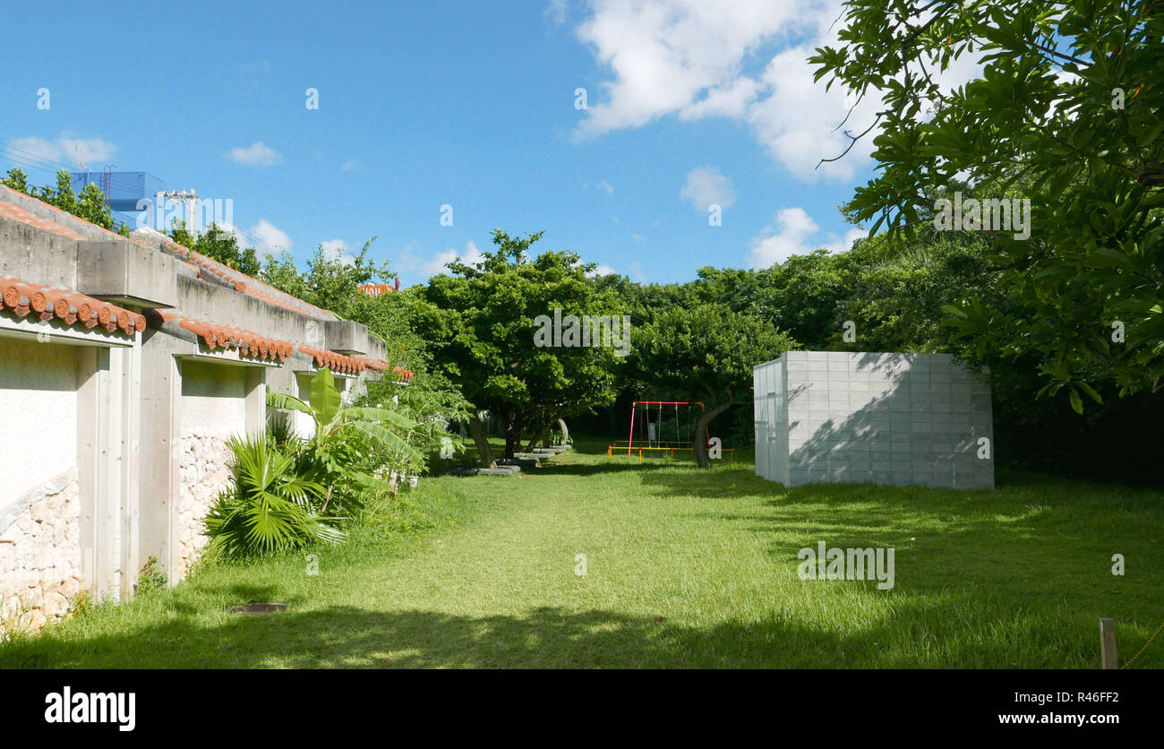 Small green field behind the house Stock Photo - Alamy