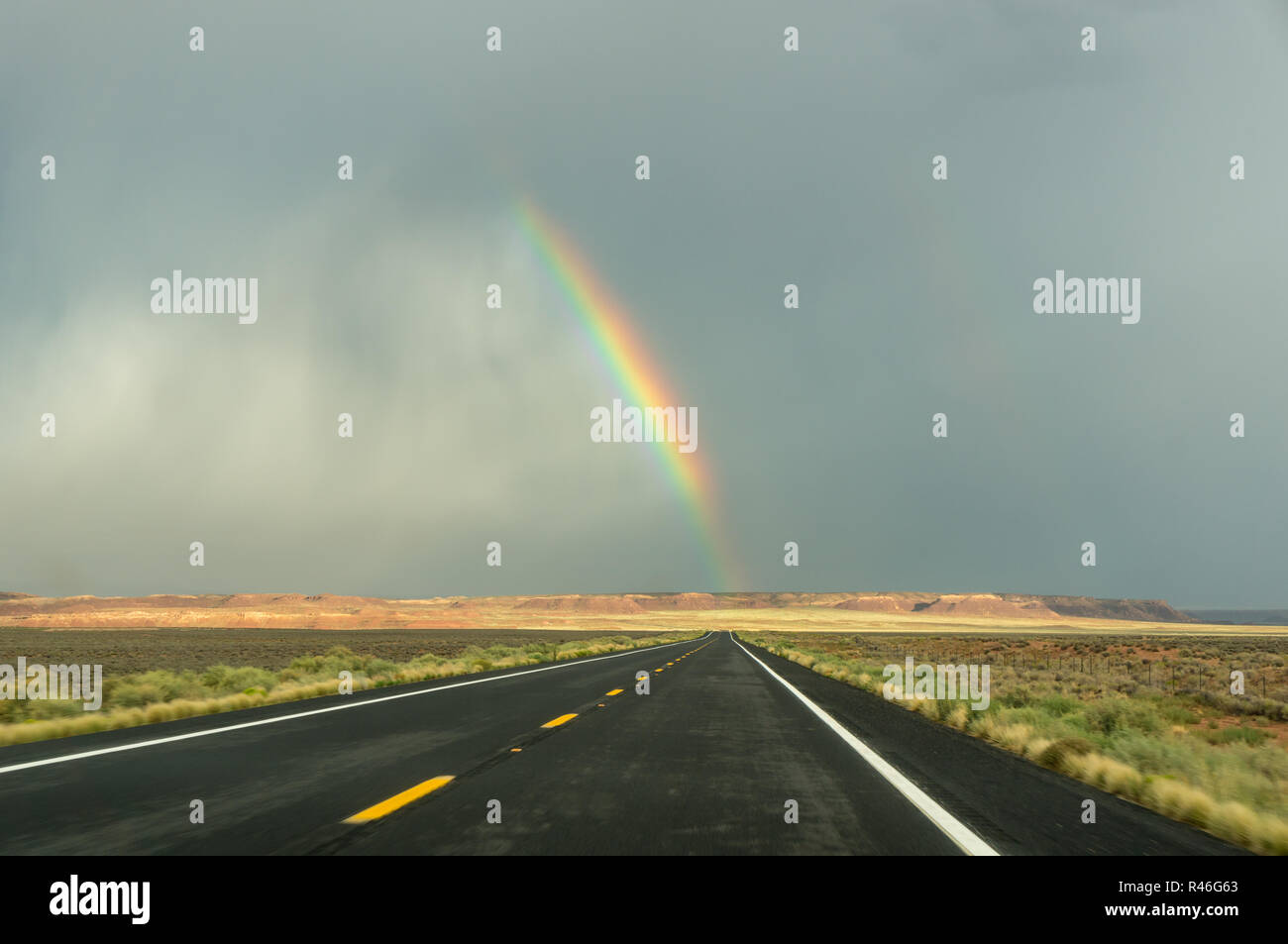 Rainbow clouds rain sun blue sky hi-res stock photography and images ...