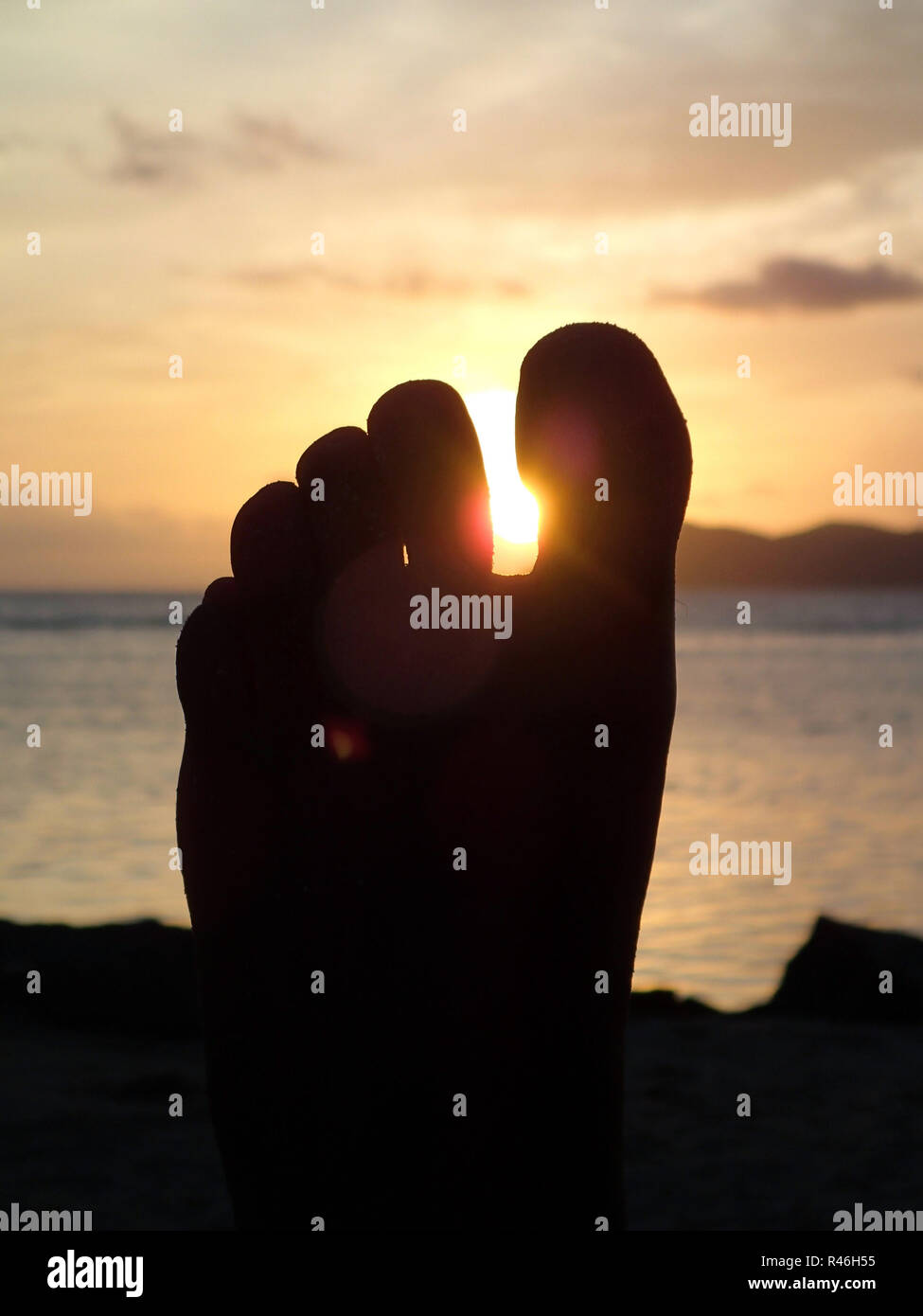 foot with sunset - seychelles Stock Photo - Alamy