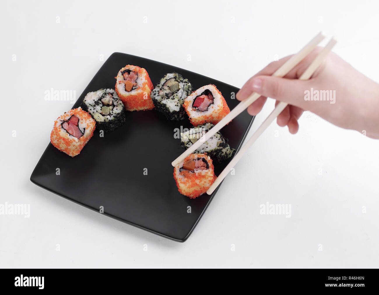 closeup.sticks and a set of Sushi rolls Stock Photo - Alamy