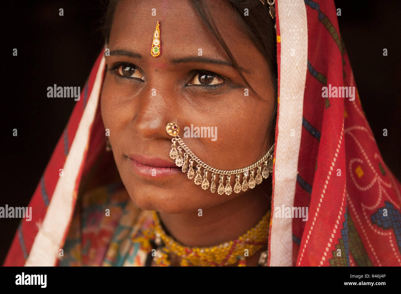 Portrait of traditional Indian female thinking Stock Photo - Alamy