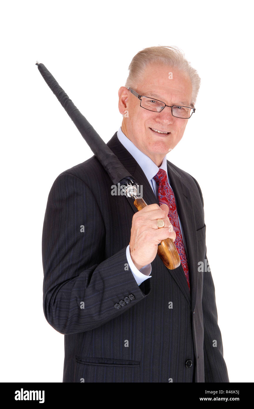 Senior man with umbrella over shoulder Stock Photo - Alamy