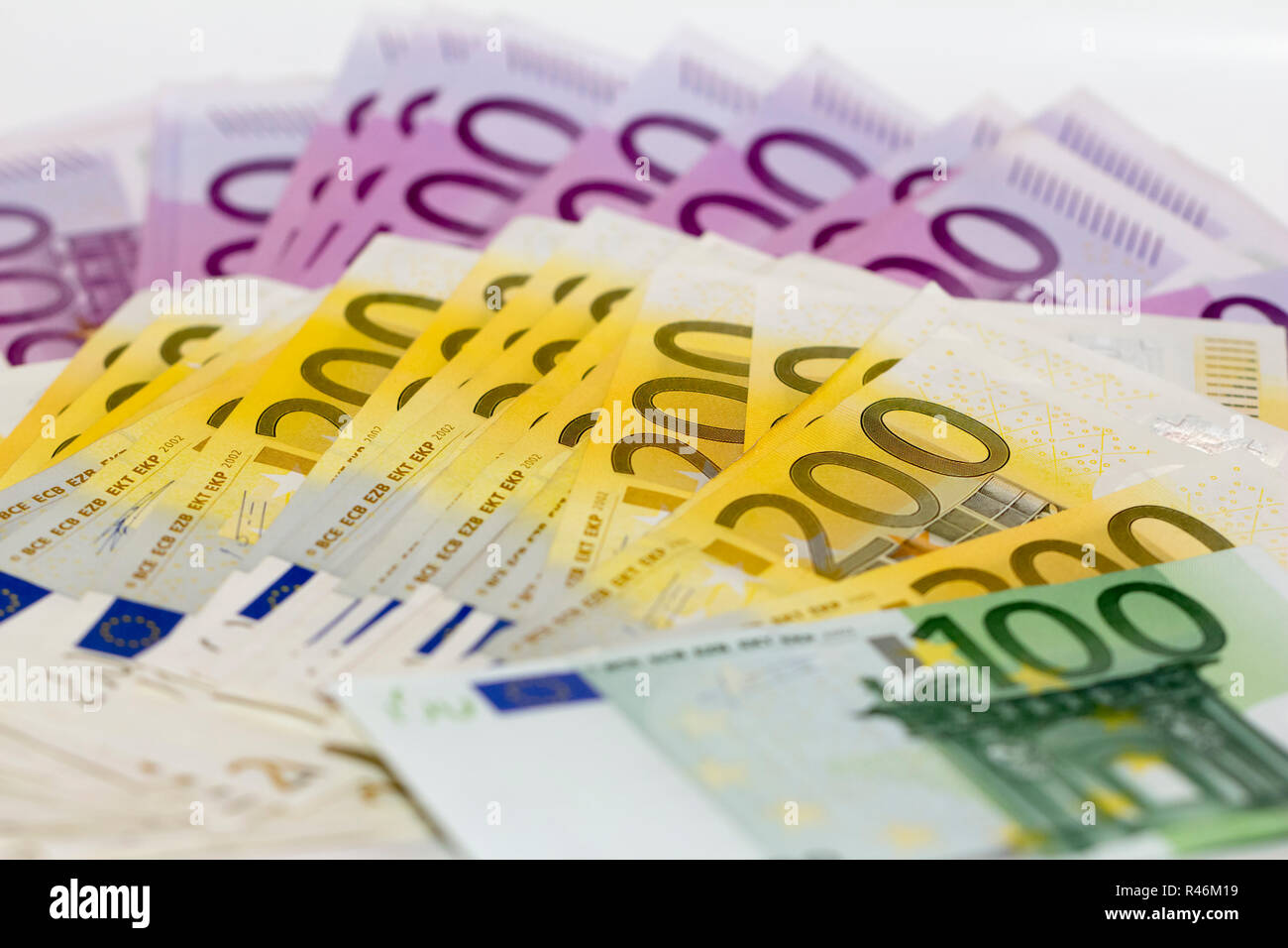 Isolated stack of money with 100 200 and 500 euro banknotes Stock Photo ...