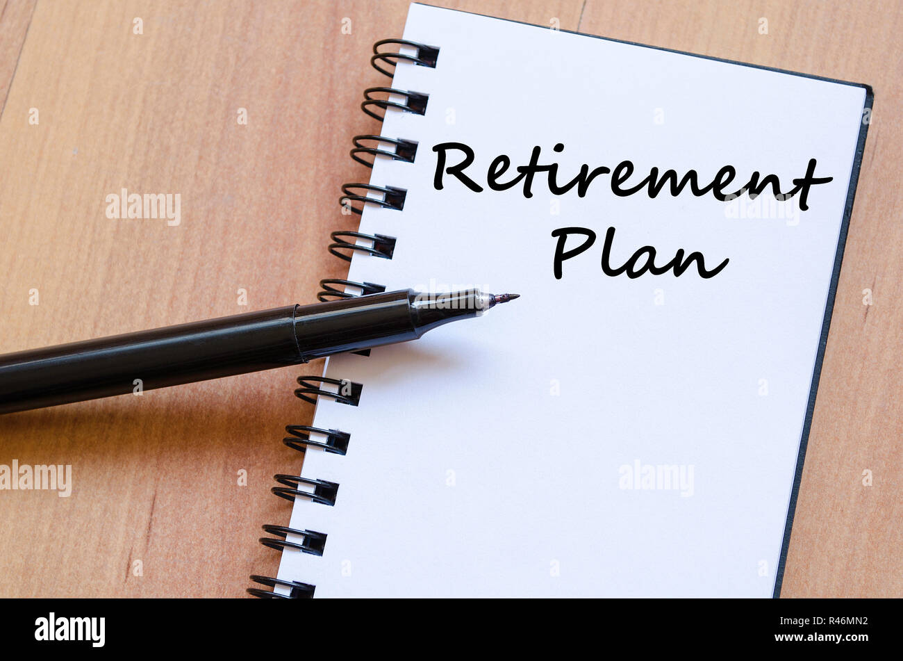 Retirement plan write on notebook Stock Photo - Alamy