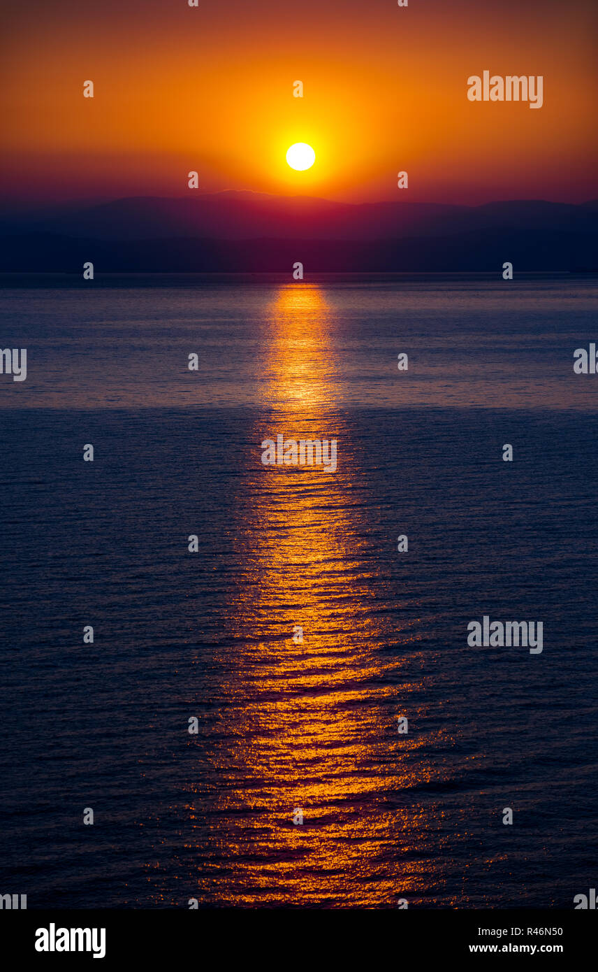 The Rising Sun Over the Sea Stock Photo - Alamy