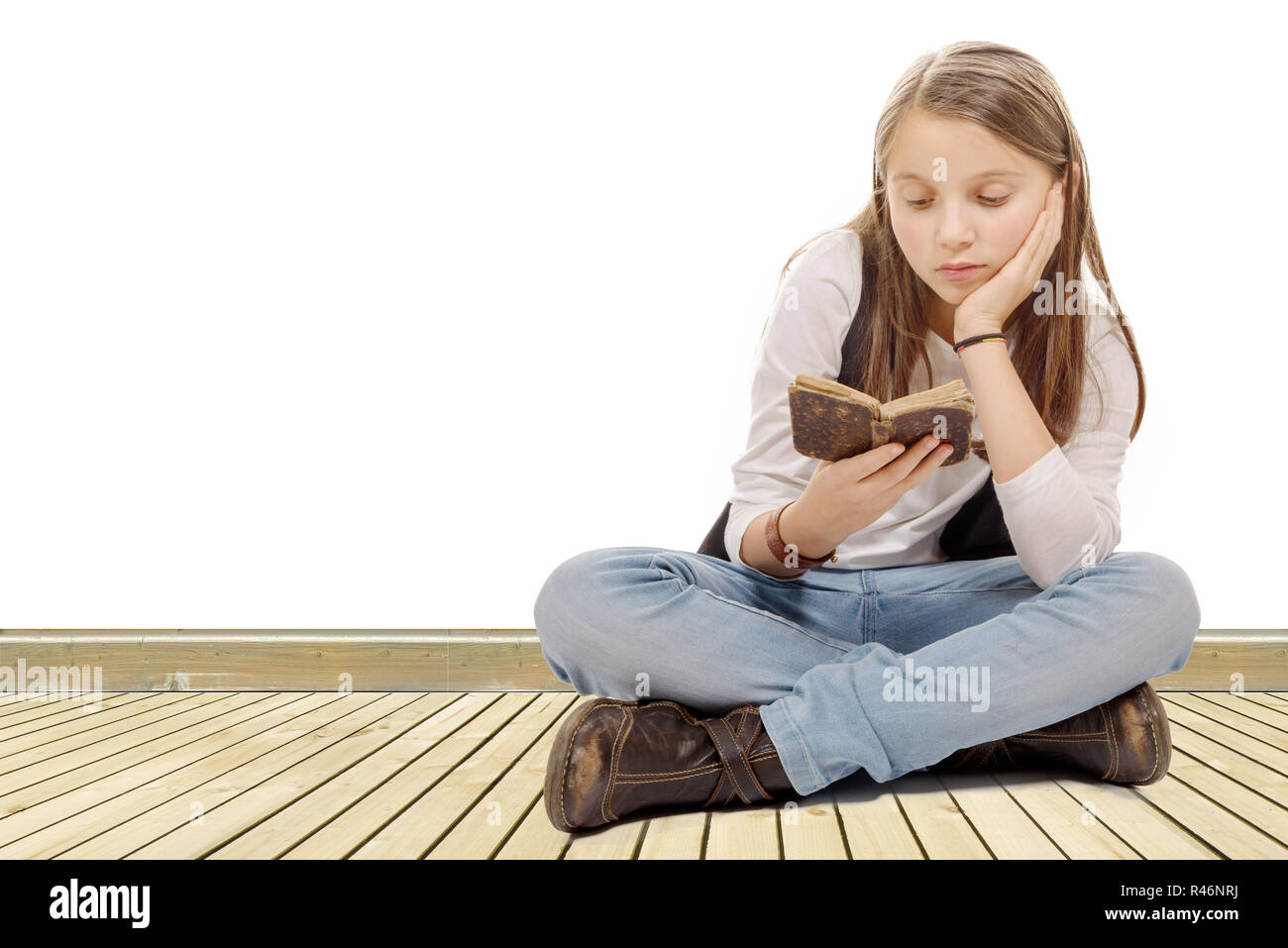 little student girl studying and reading book at school Stock Photo - Alamy