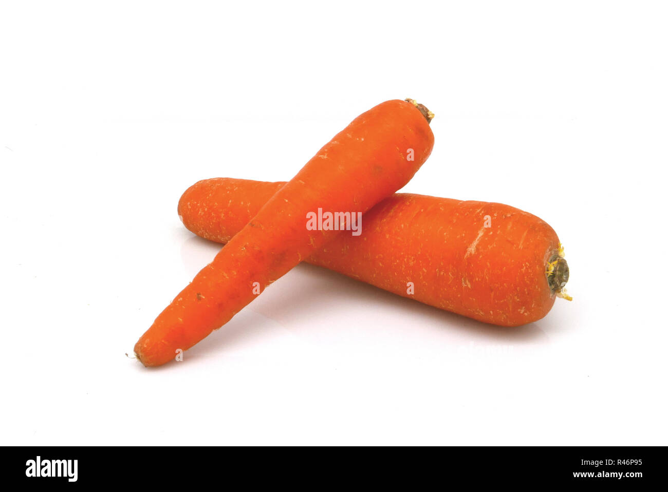 Two carrots isolated on white background Stock Photo - Alamy