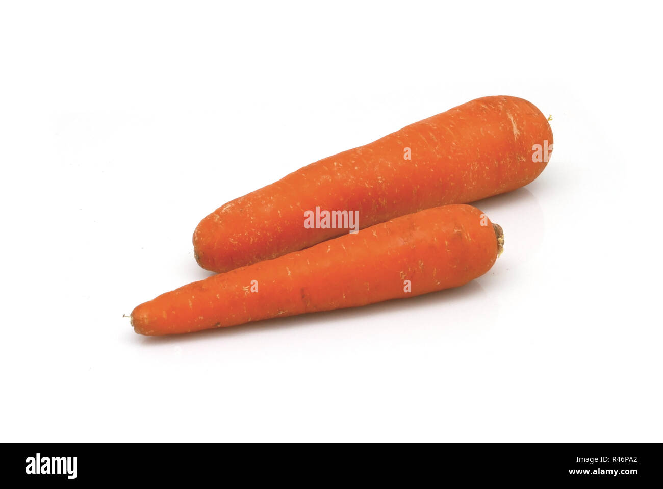 Two carrots isolated on white background Stock Photo - Alamy
