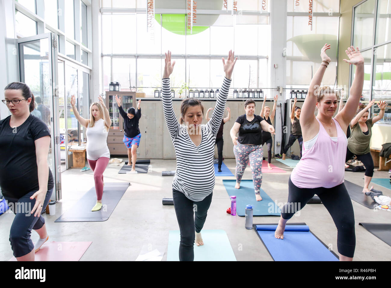 TORONTO, ONTARIO, CANADA - MAY 27, 2018: PEOPLE DO YOGA AT PARENTING ...
