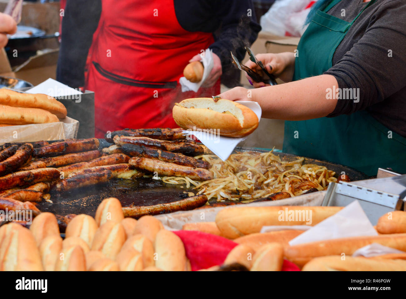 Street food stall serving freshly prepared hot dogs with onions Stock ...